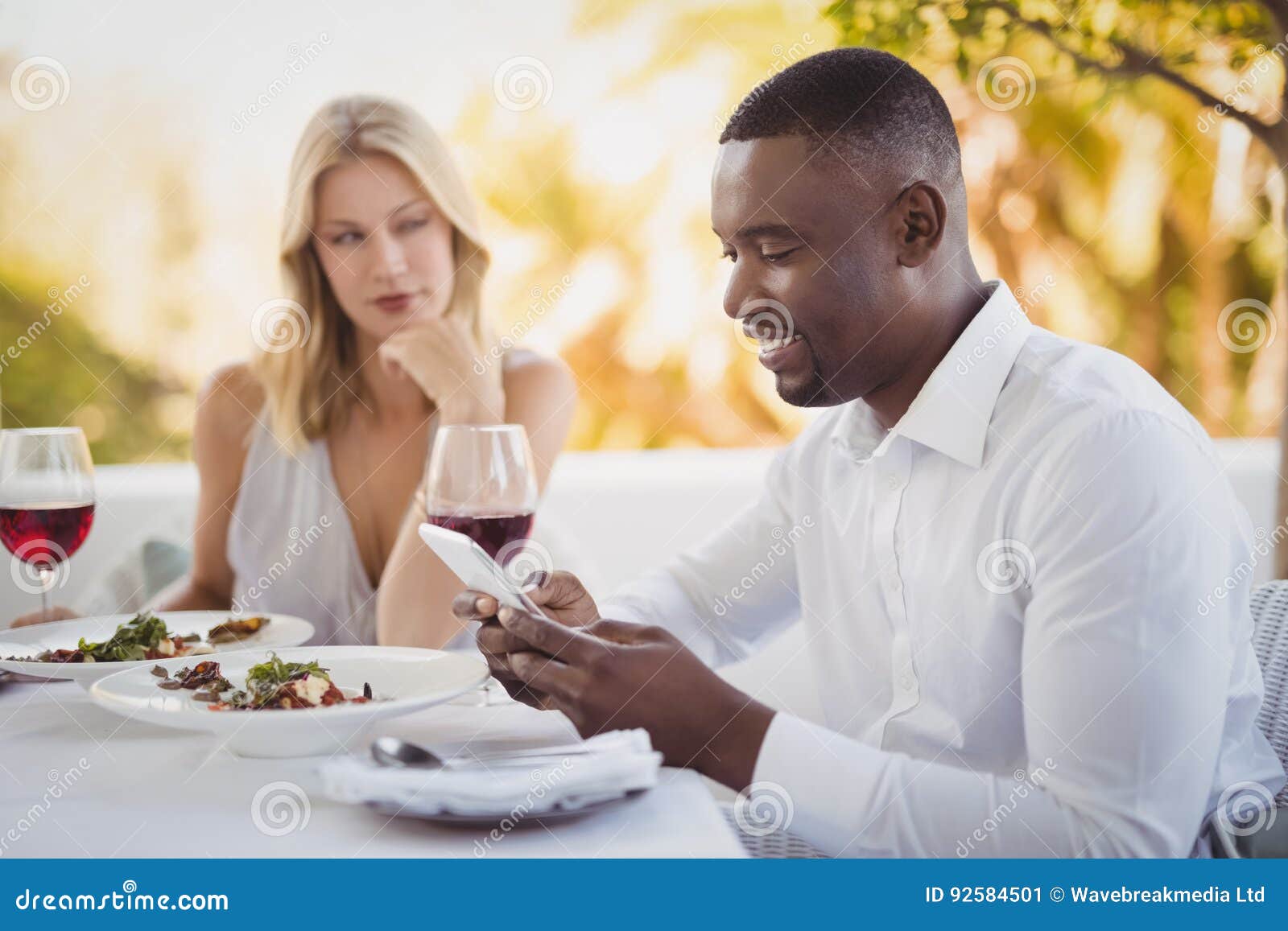 Man Ignoring Bored Woman while Using Mobile Phone Stock Image - Image ... Man Ignoring Bored Woman while Using Mobile Phone Stock Image - Image ...
