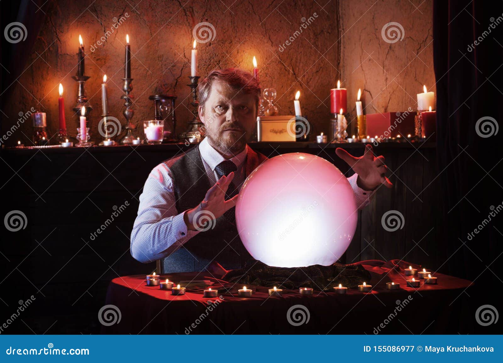 Man with Illuminated Crystal Ball Stock Image - Image of blue, candle ...