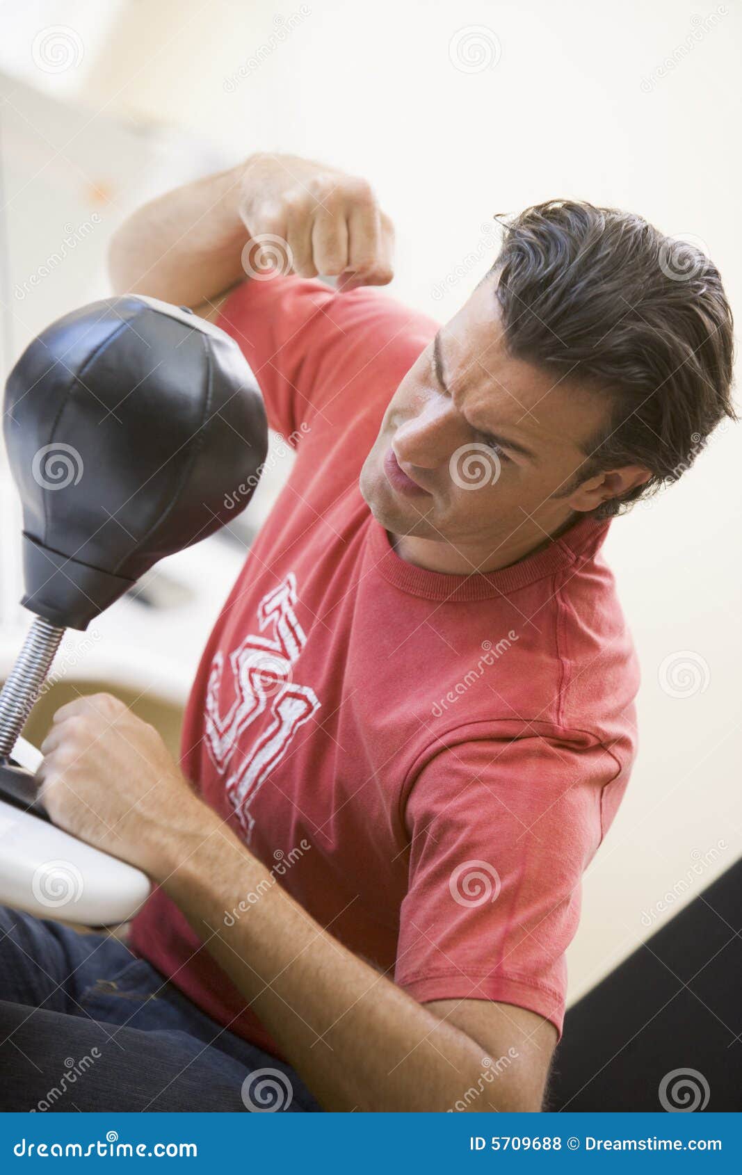 Man Indoors Using Small Punching Bag Stock Photo - Image of punching ...