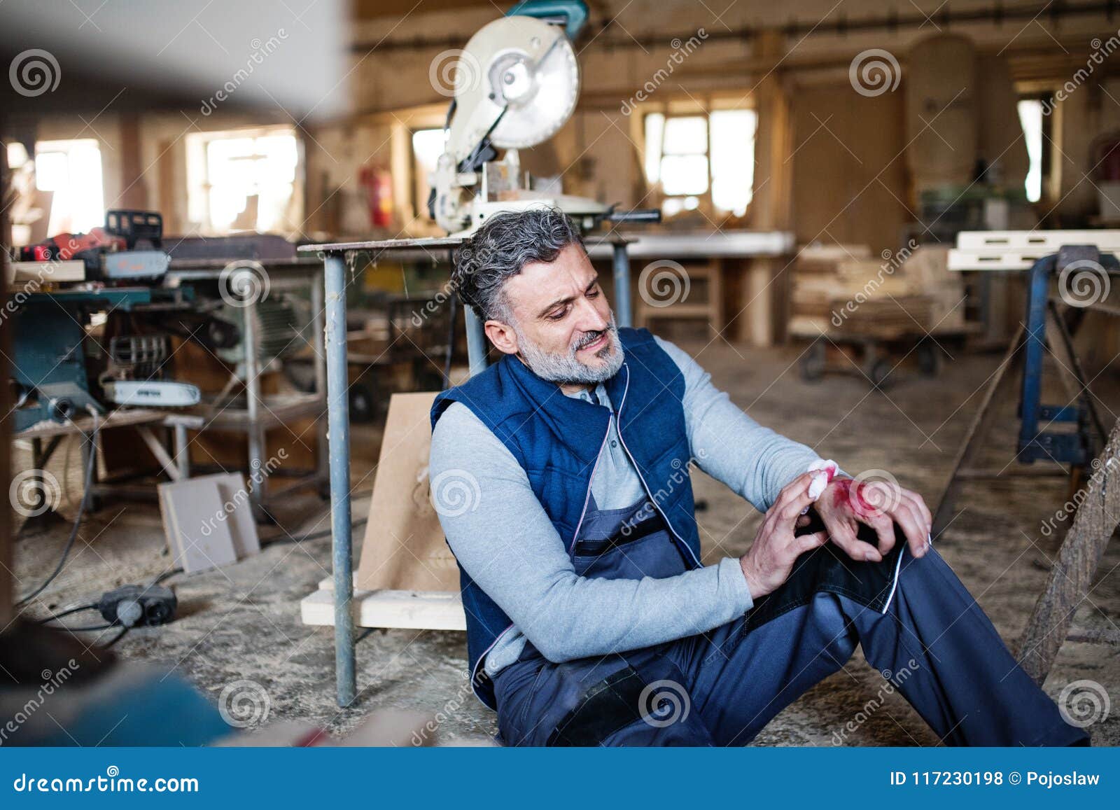 Man with an Injured Hand after Accident at Work in the Carpentry ...