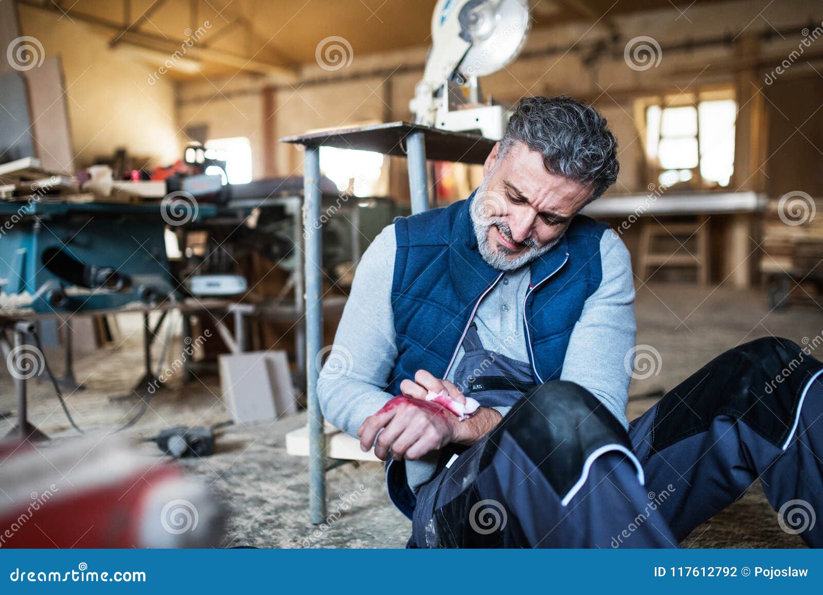 Man with an Injured Hand after Accident at Work in the Carpentry ...
