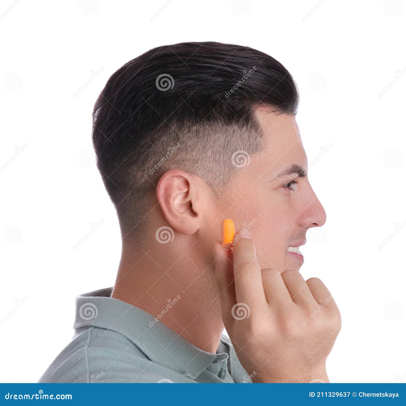 Man Inserting Foam Ear Plug on White Background Stock Image - Image of ...