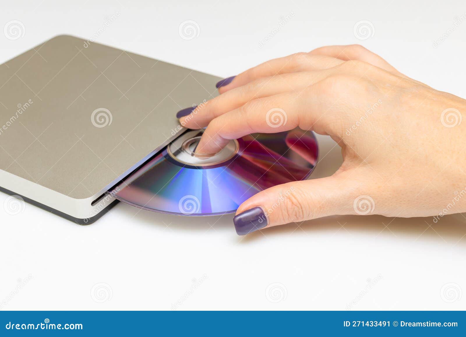 Man Inserting a Laser Disc into a Disk Drive Stock Image - Image of ...