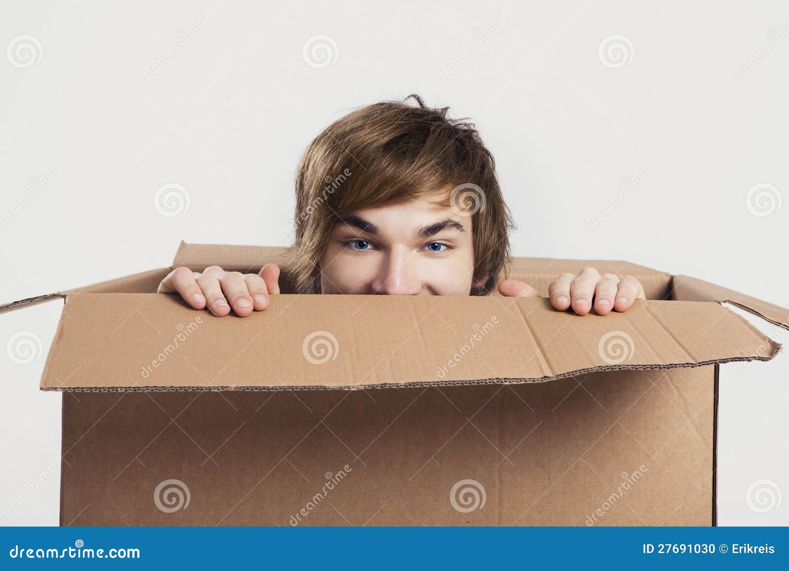Man inside a card box stock photo. Image of hiding, grimace - 27691030