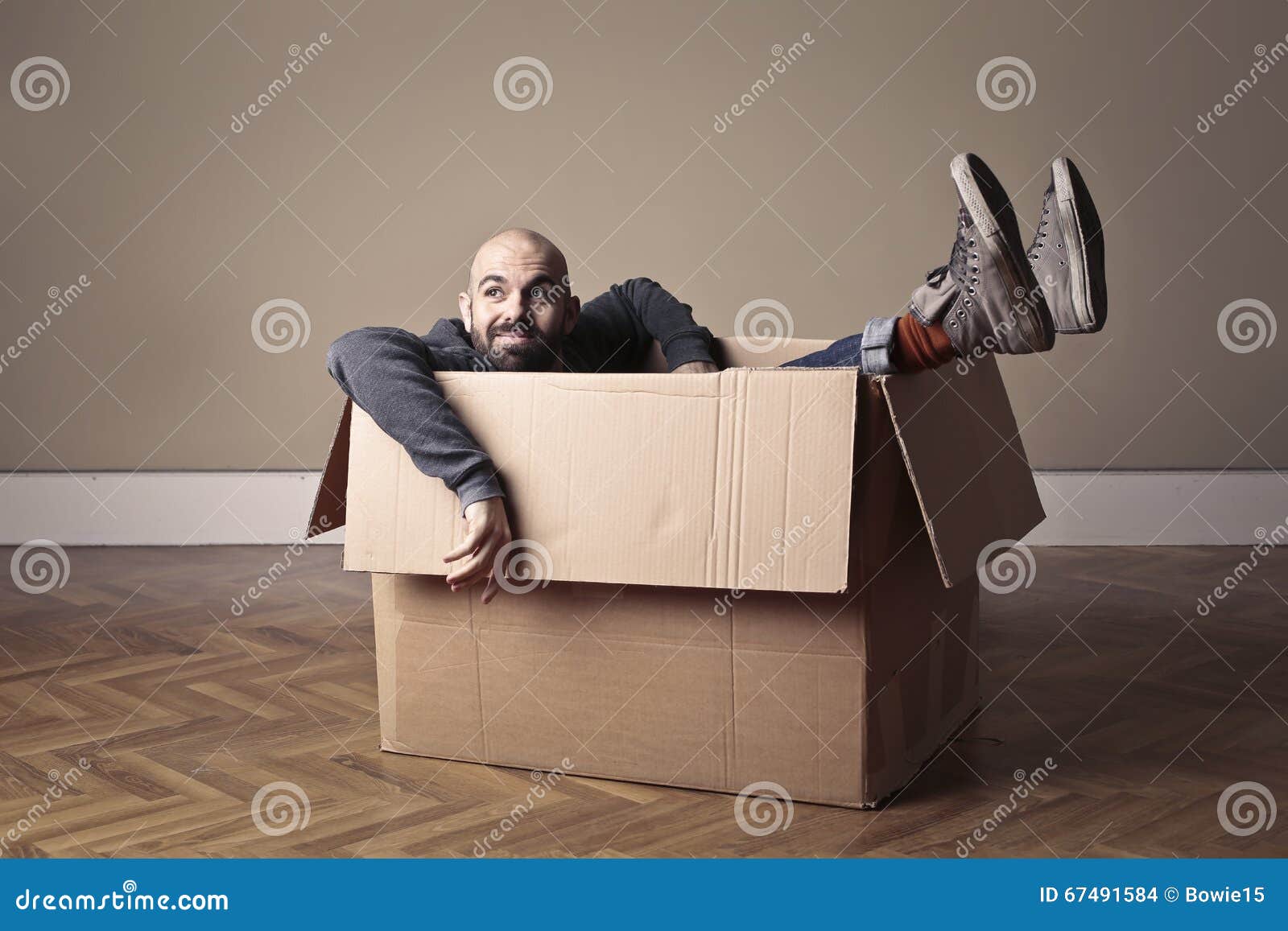 Man inside a cardboard box stock photo. Image of interior - 67491584
