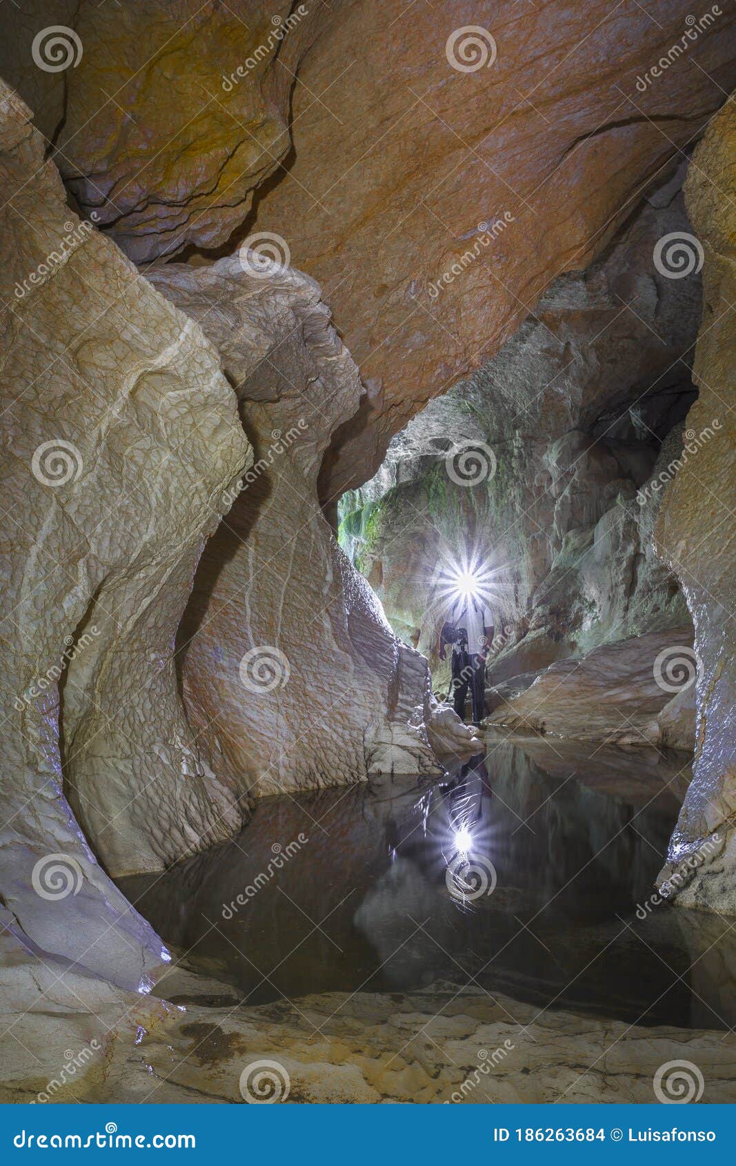 Man Inside Cave with Headlight Stock Photo - Image of magic, black ...