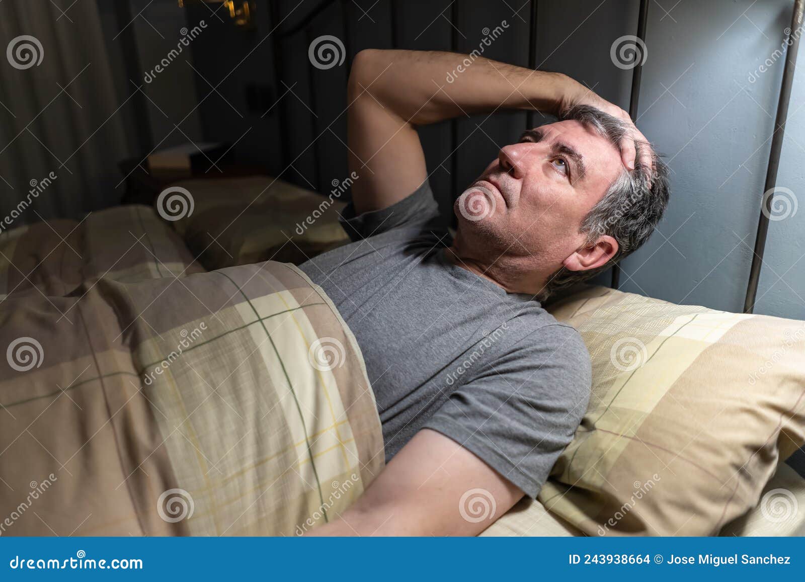 Man with Insomnia Lying in Bed and Pensively Looking at the Ceiling ...