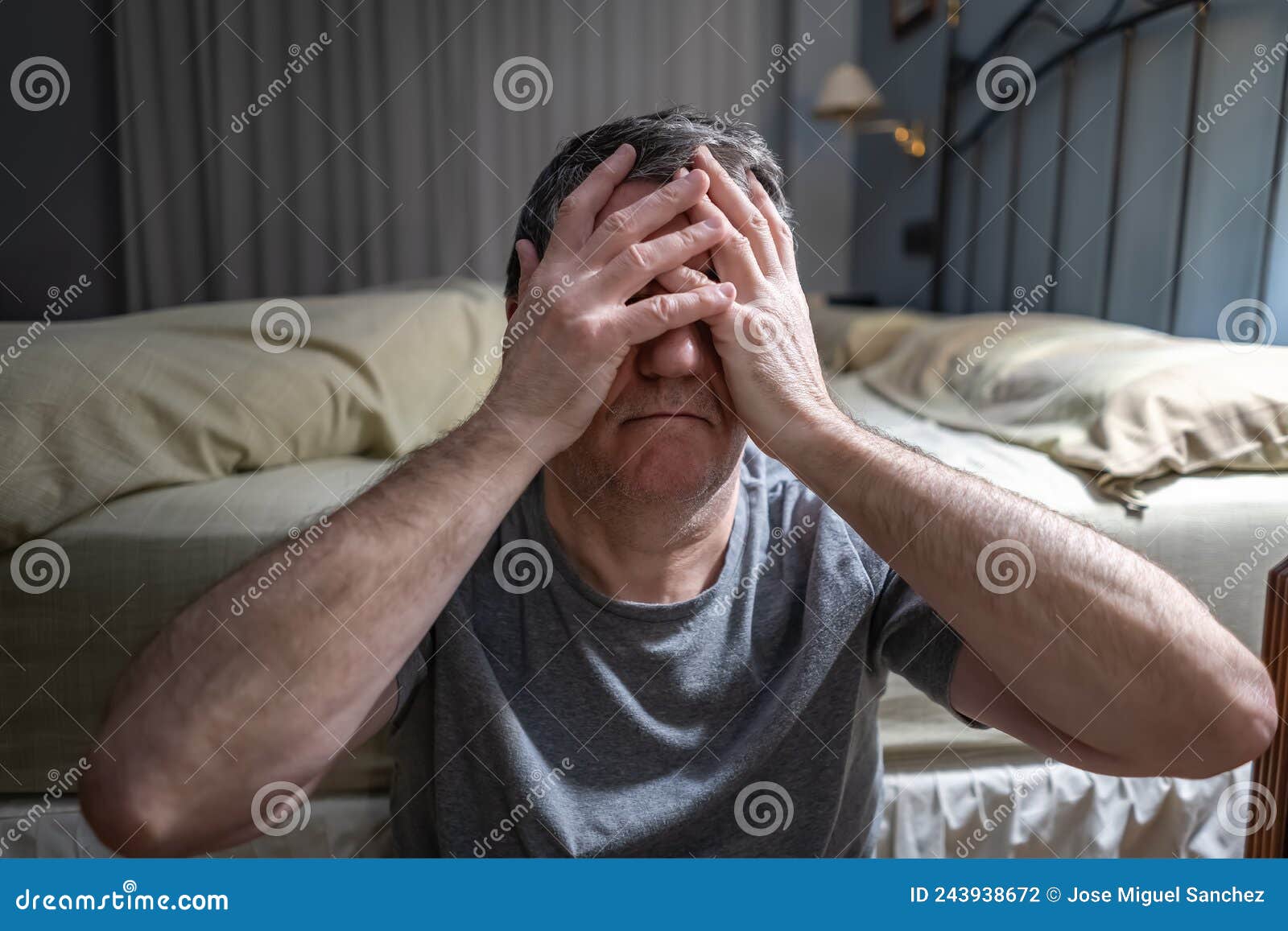 Man with Insomnia Sitting on the Floor and with His Hands on His Face ...