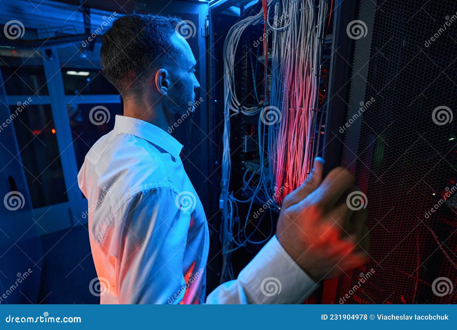 Man Inspecting Cables and Wires of Network Equipment Stock Photo ...