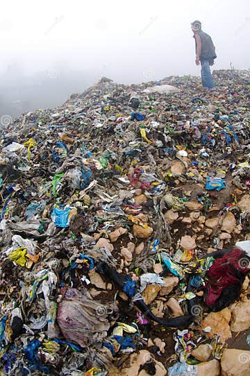 Man Inspecting an Mountain of Trash Editorial Stock Image - Image of ...