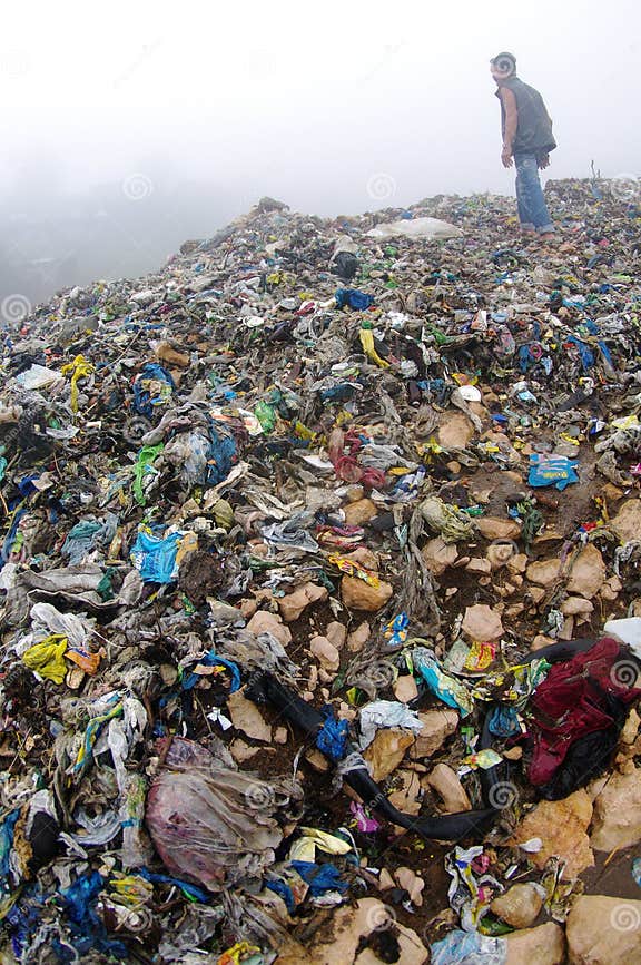 Man Inspecting an Mountain of Trash Editorial Stock Image - Image of ...