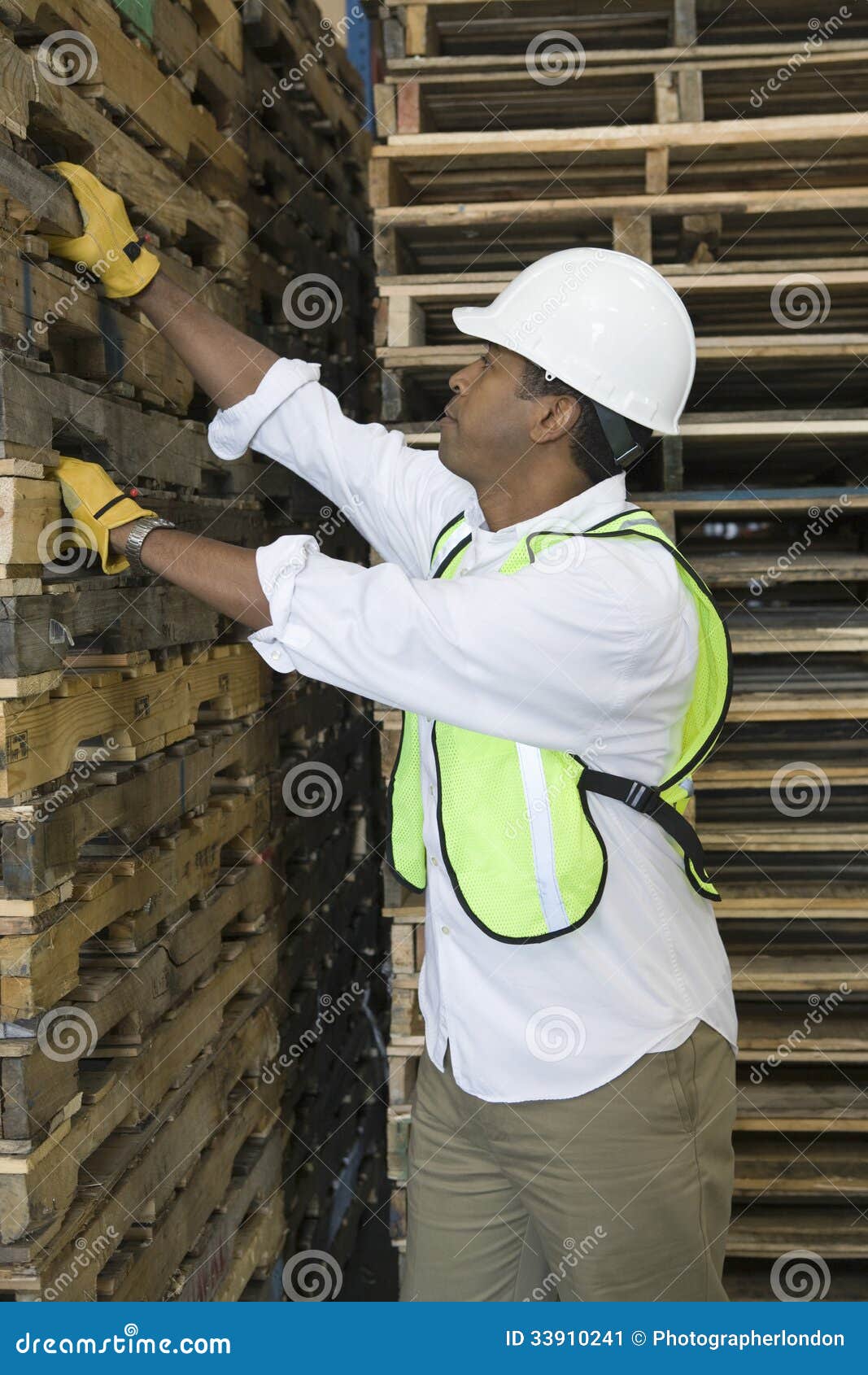 Man Inspecting Pallets in Warehouse Stock Image - Image of black ...
