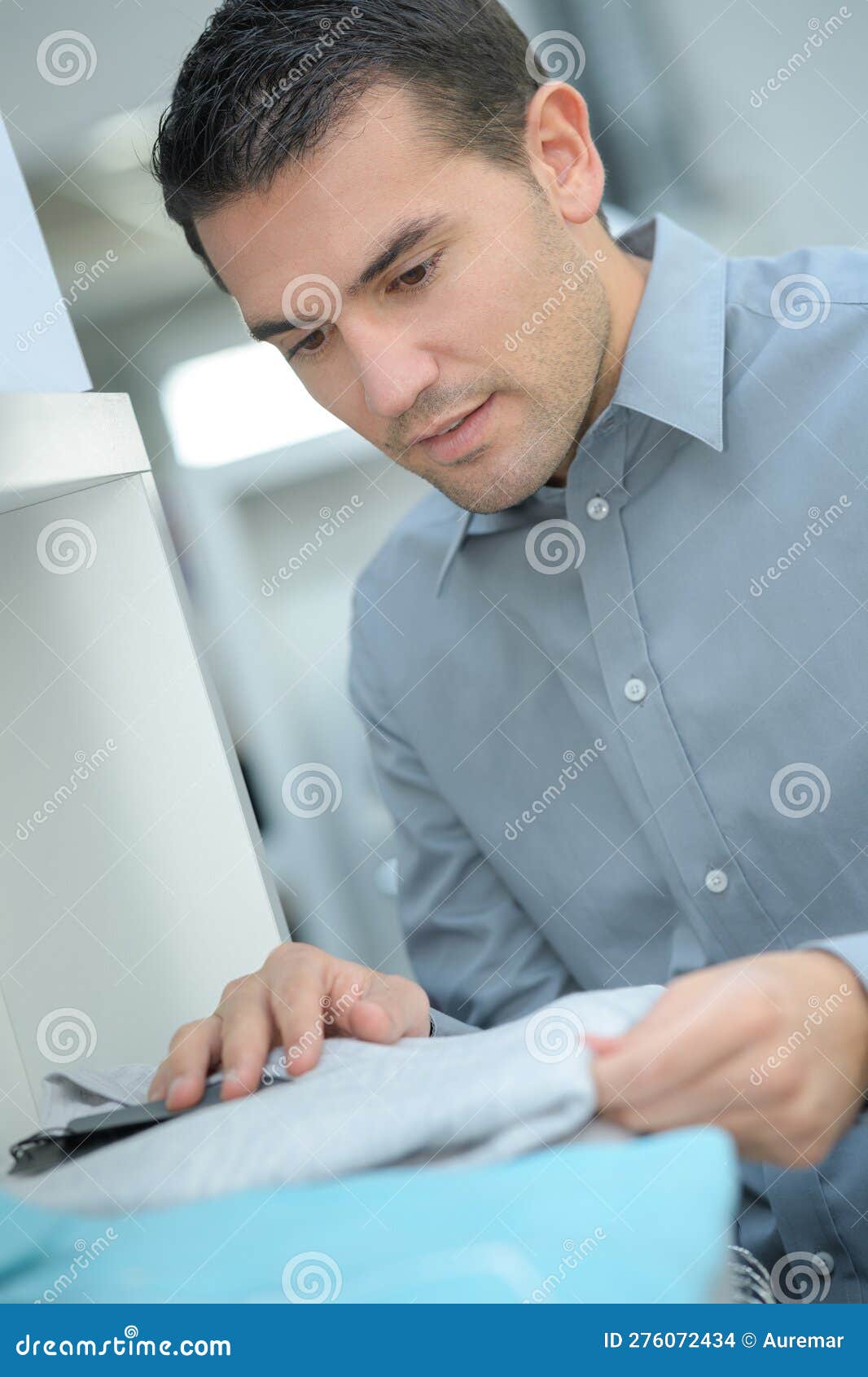 Man inspecting paperwork stock photo. Image of data - 276072434