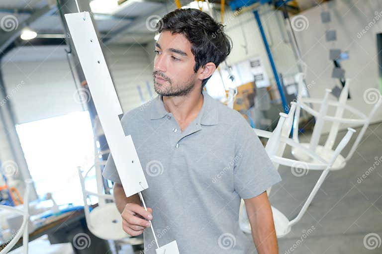 Man Inspecting Suspended Object Stock Photo - Image of clean, ceiling ...