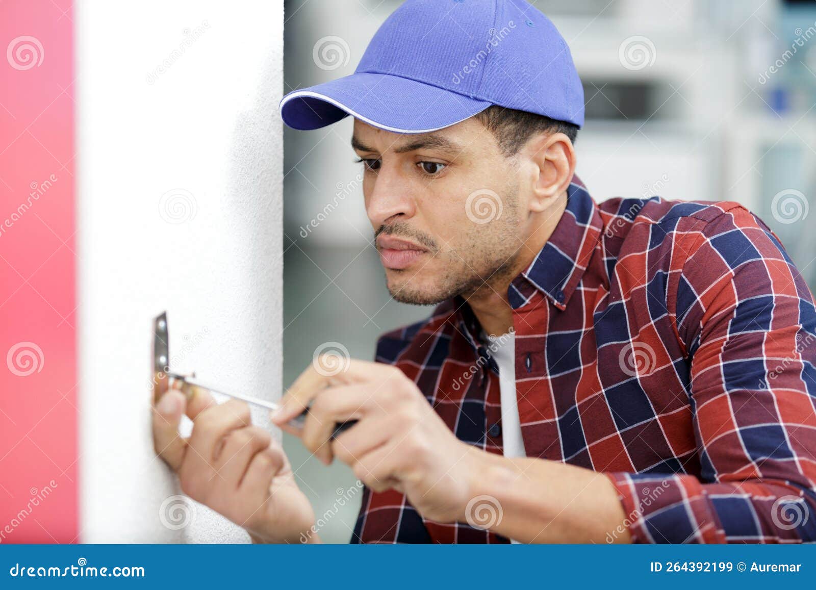Man Installer Attaches Metal Hooks for Shelving Stock Image - Image of ...