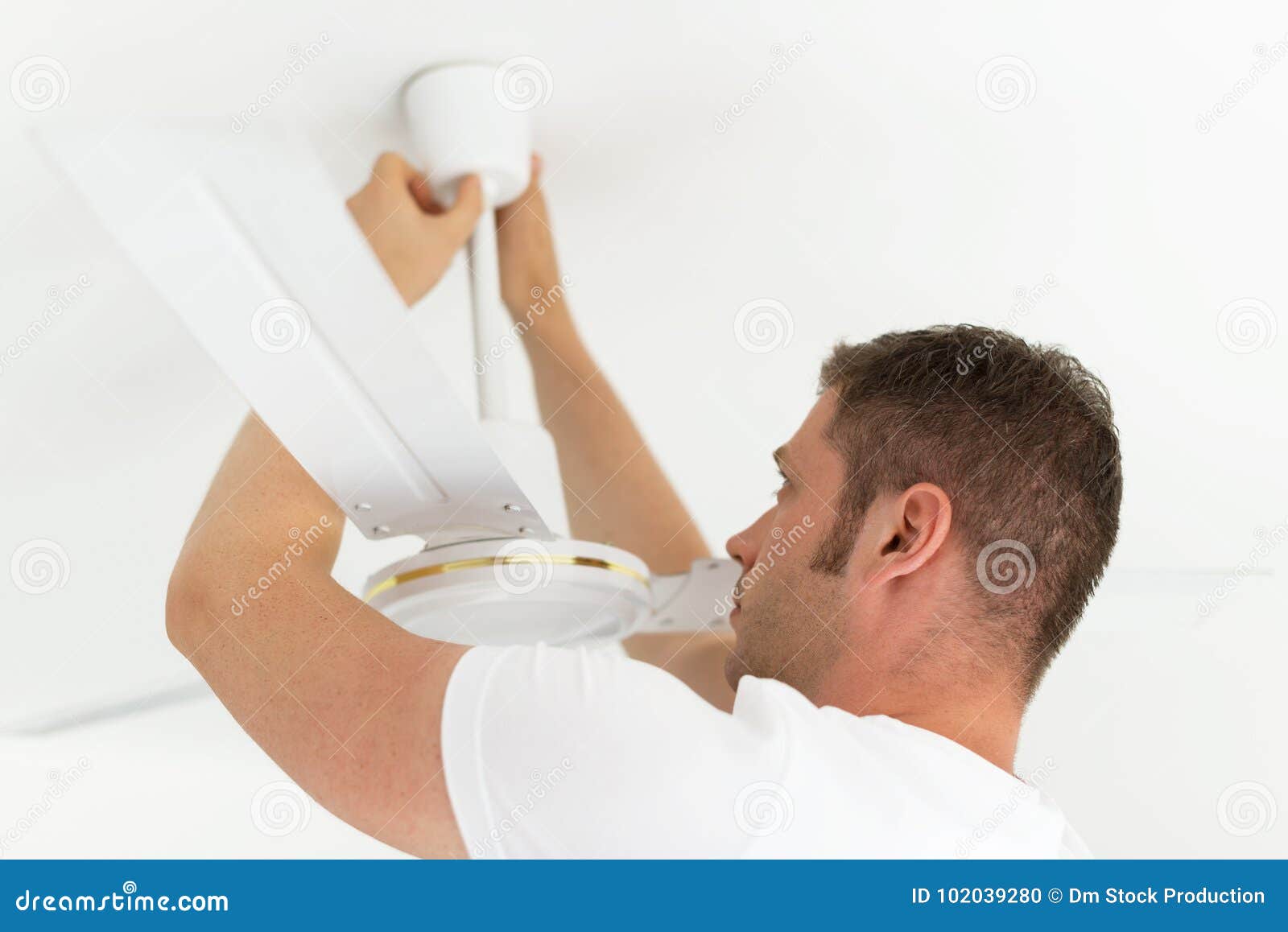 Man installing fan. stock photo. Image of conditioning - 102039280