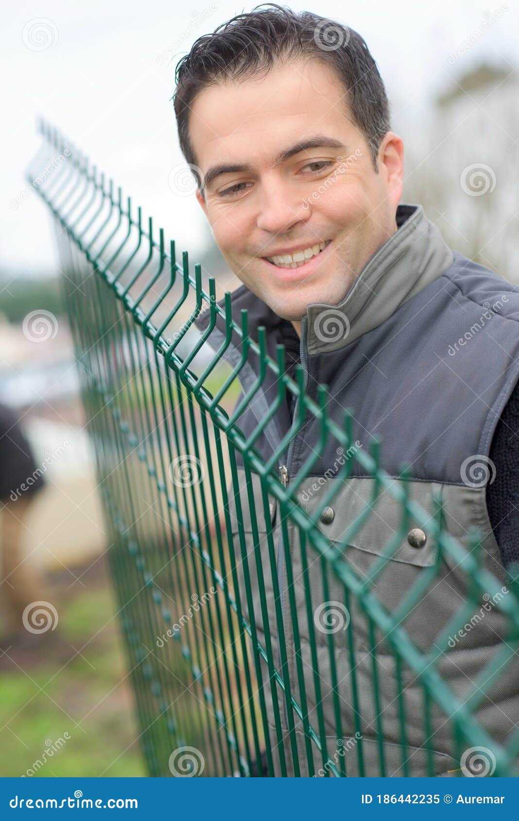 Man installing fence stock image. Image of work, space - 186442235