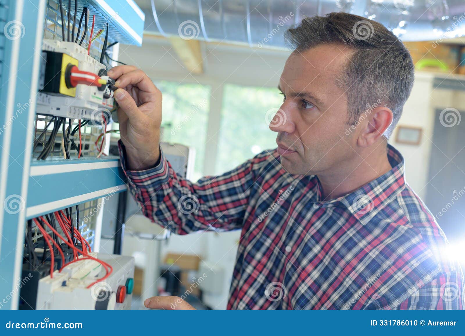 Man Installing Fiber Optic Cable in Factory Stock Photo - Image of ...