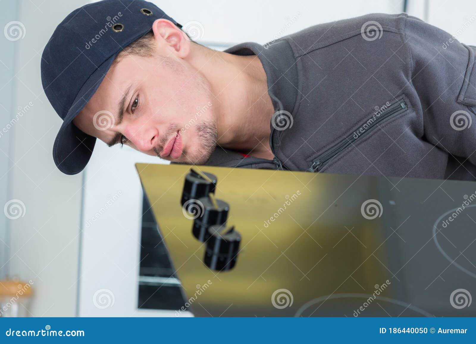 Man Installing Kitchen Hob Looking Confused Stock Photo - Image of ...