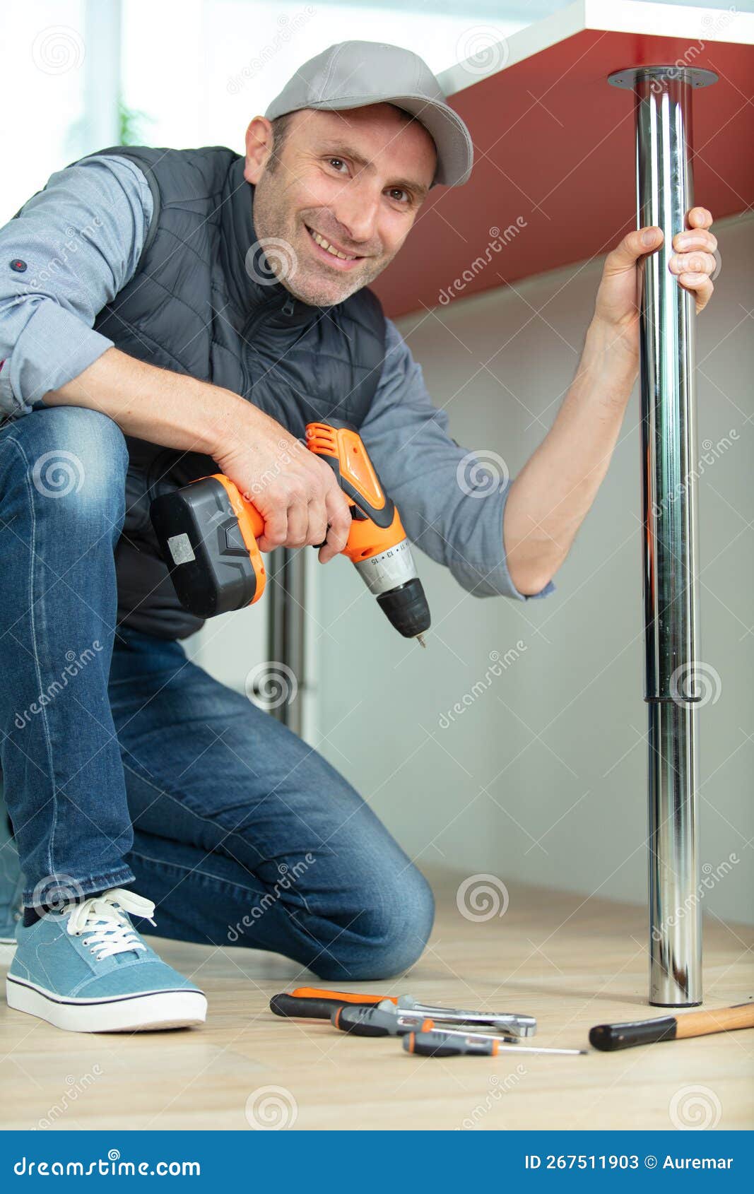 Man Installing Metal Support for Breakfast-bar Stock Image - Image of ...