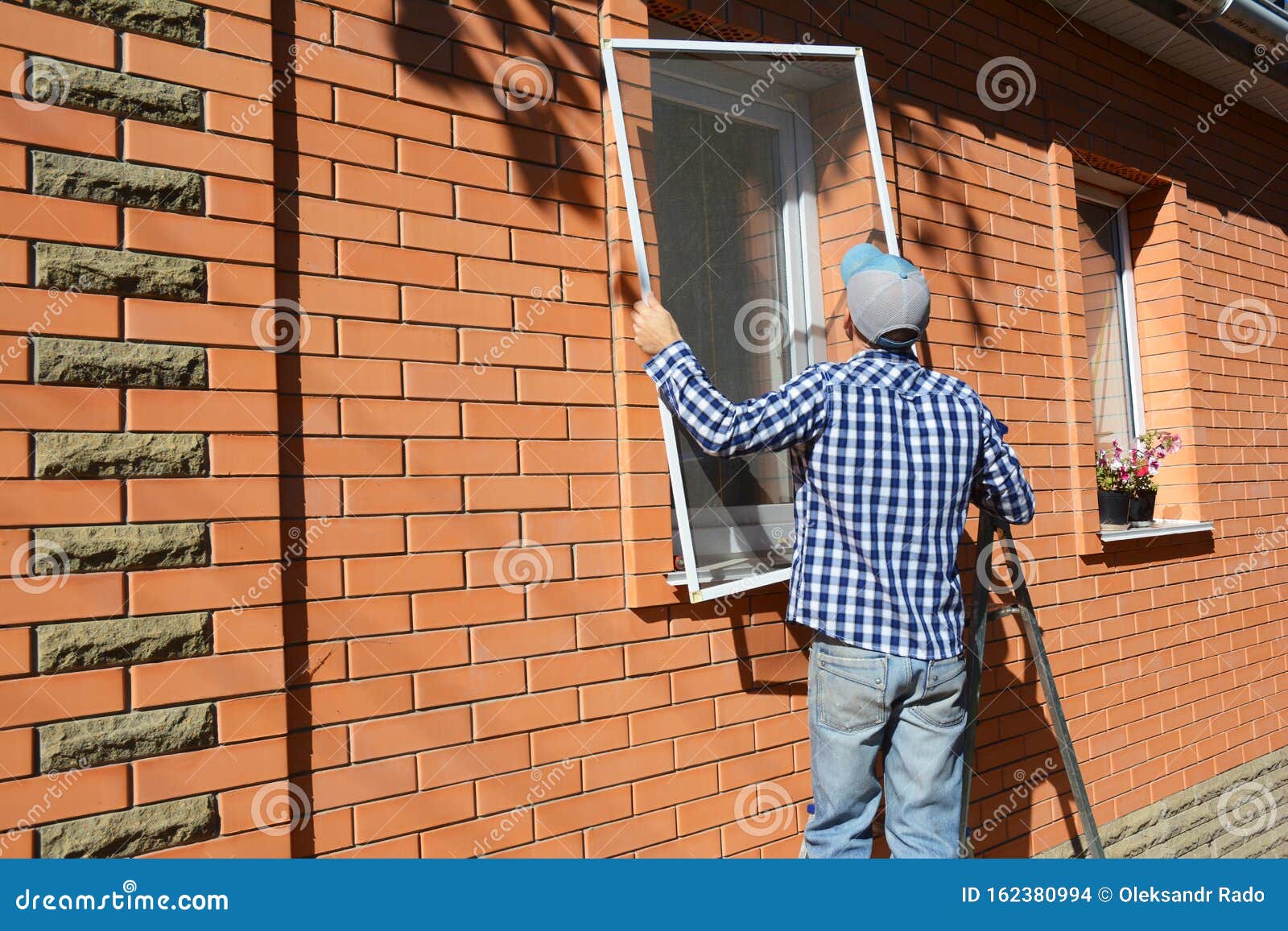 Man Installing Mosquito Net Screen on House Window Stock Photo - Image ...