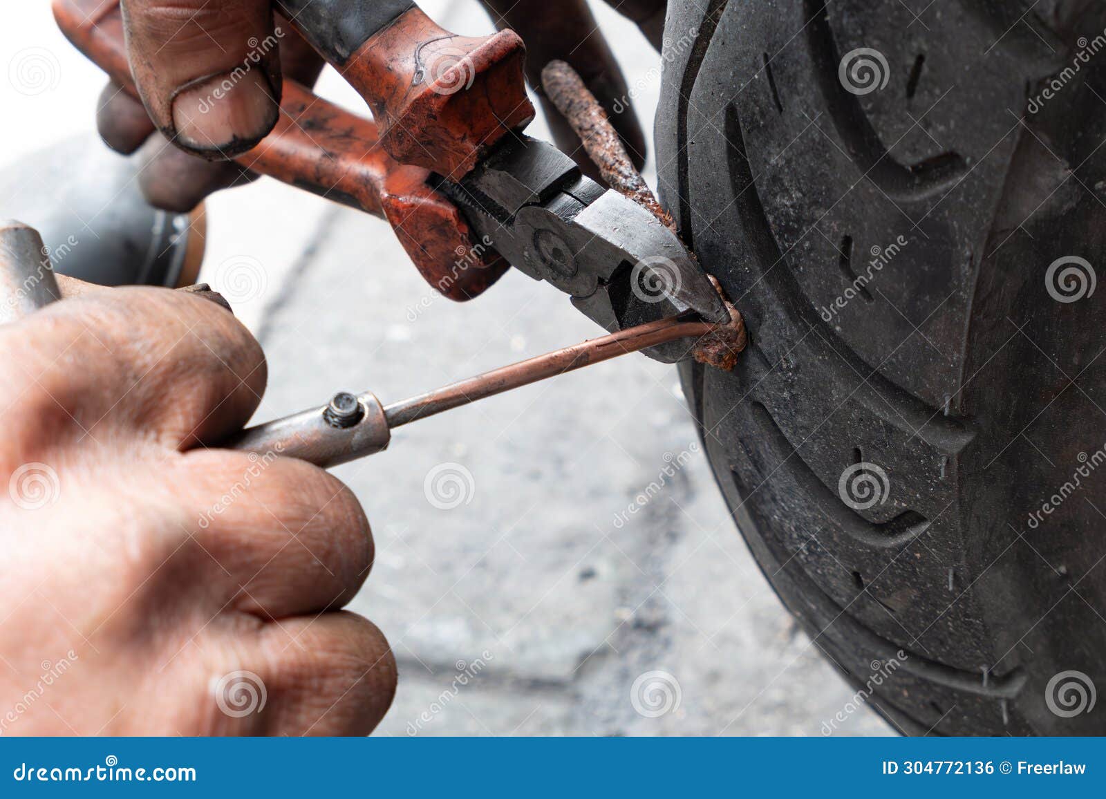 Man Installing Patch and Fixing a Tire Stock Photo - Image of ...