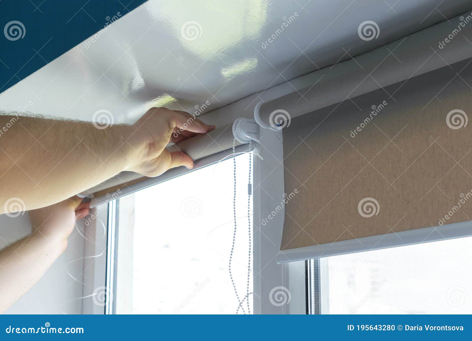 Man Installing Roller Blinds, Shades on Window at Home, Close Up with ...