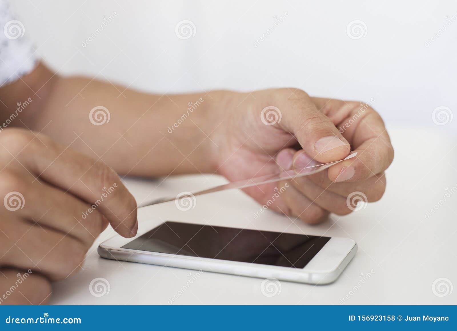 Man Installing a Screen Protector in a Smartphone Stock Photo - Image ...