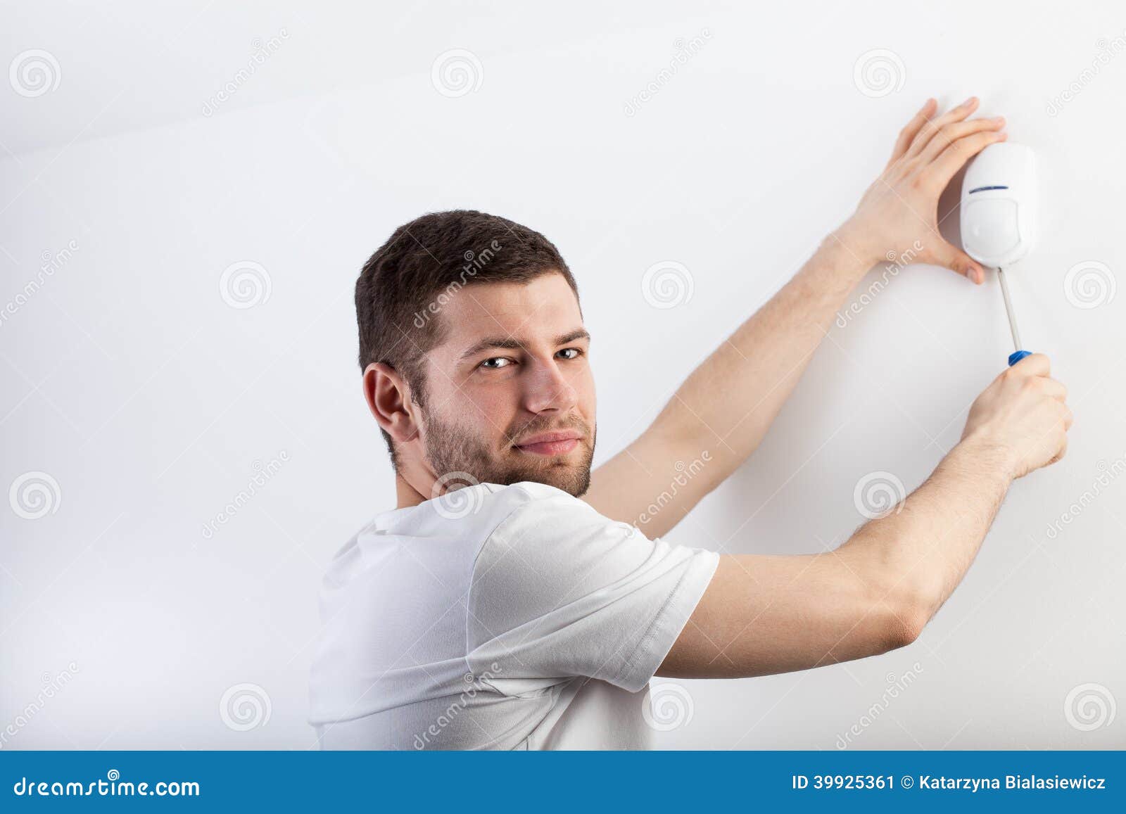 Man Installing a Security System Stock Image - Image of duties, person ...