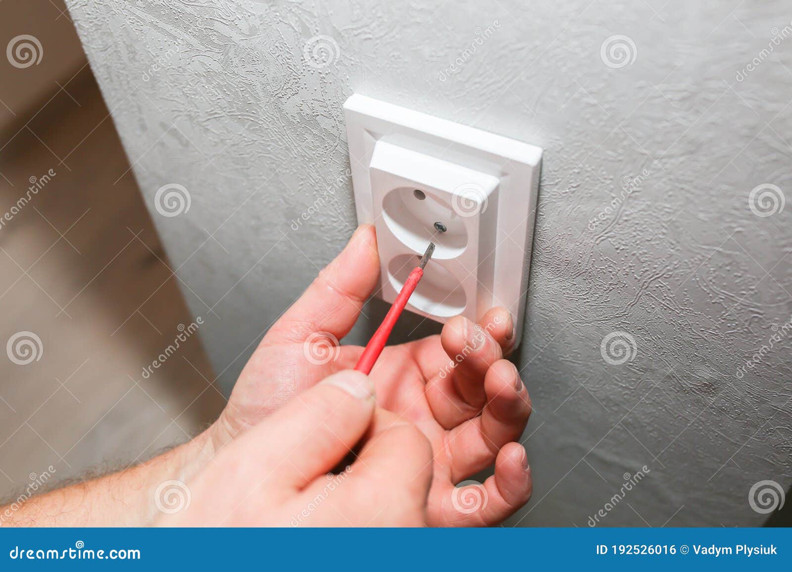 Man is Installing the Socket. Electricity Maintenance Repair Works in ...