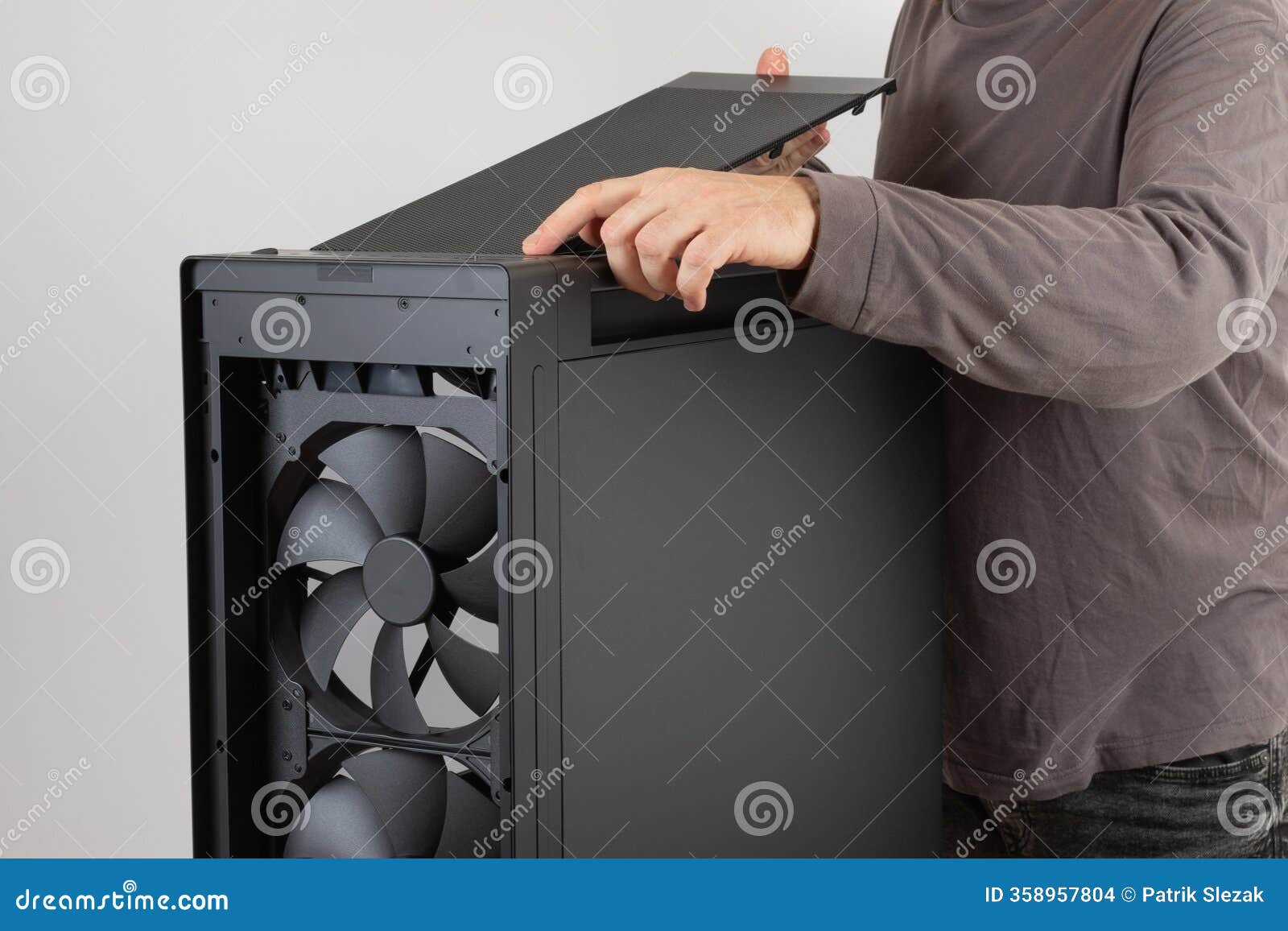 Man Installing Top Panel with Dust Filter from PC Case, Empty Big Tower ...