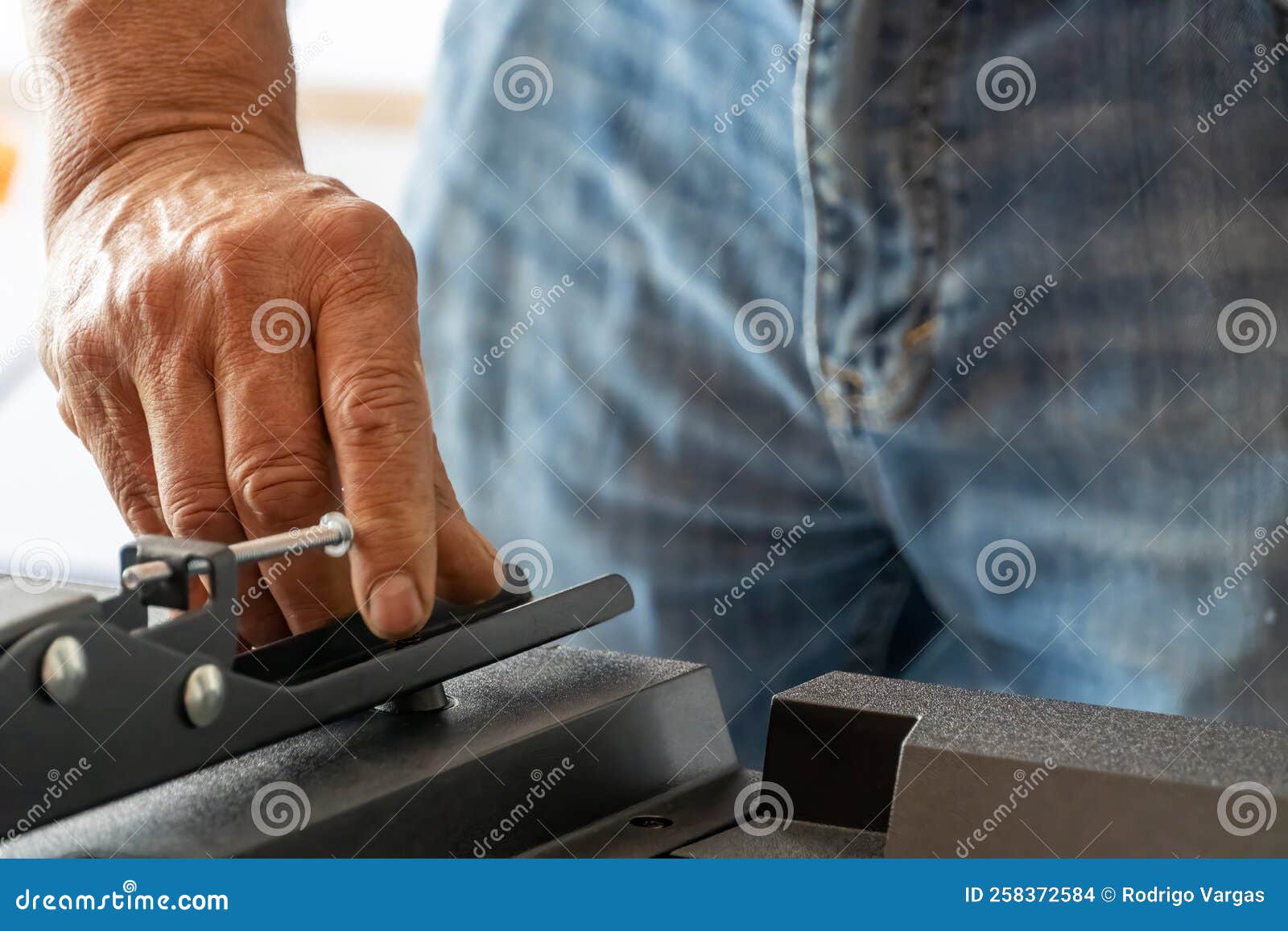 Man Installing the Wall Base for the Television, it is a Smart Tv ...