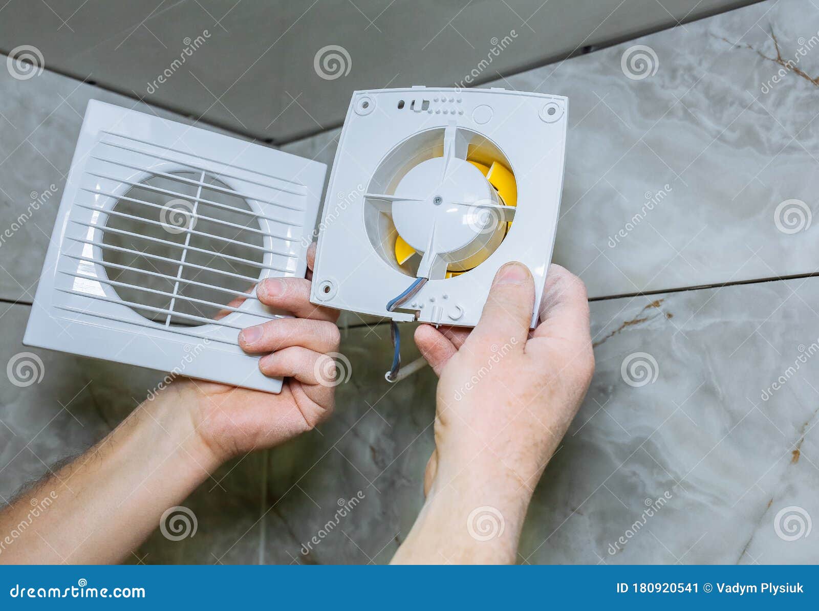 Man is Installing the Wall Bathroom Fan Vent. Restoration Process Stock ...