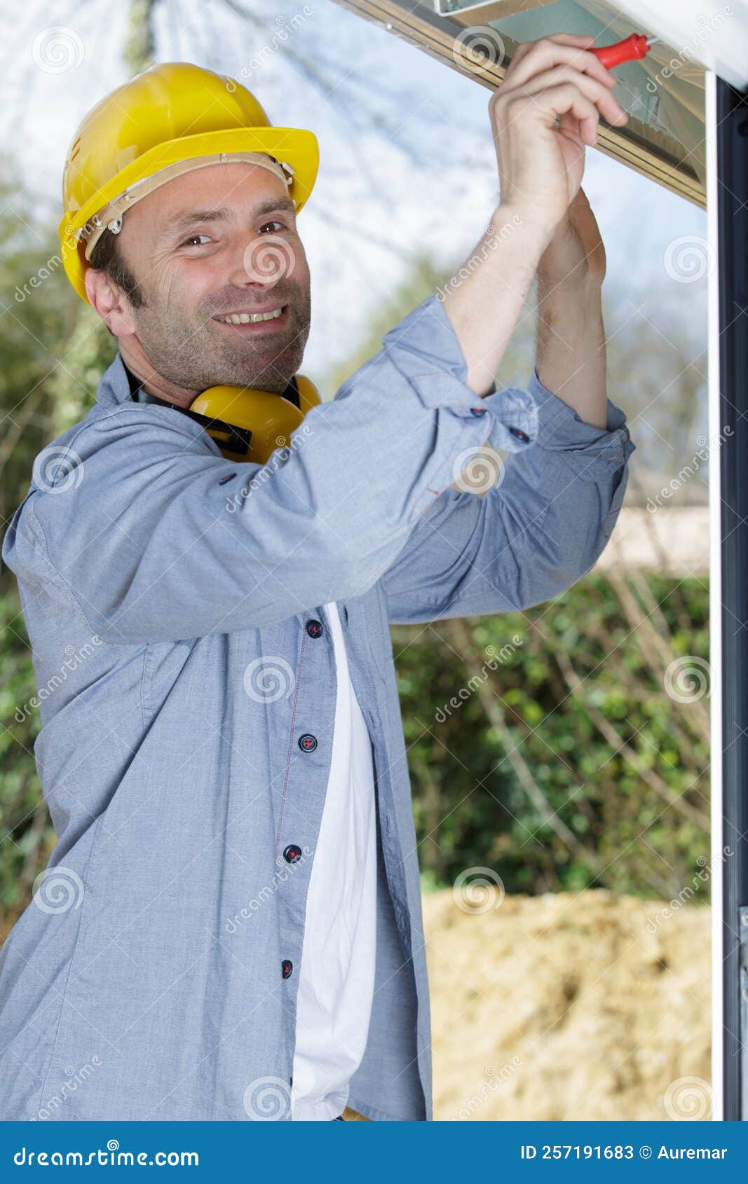 Man installing window stock image. Image of blue, serious - 257191683