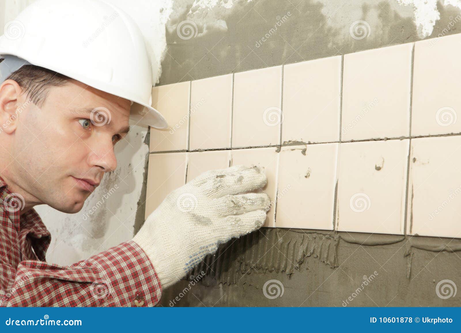 Man installs ceramic tile stock photo. Image of tile - 10601878