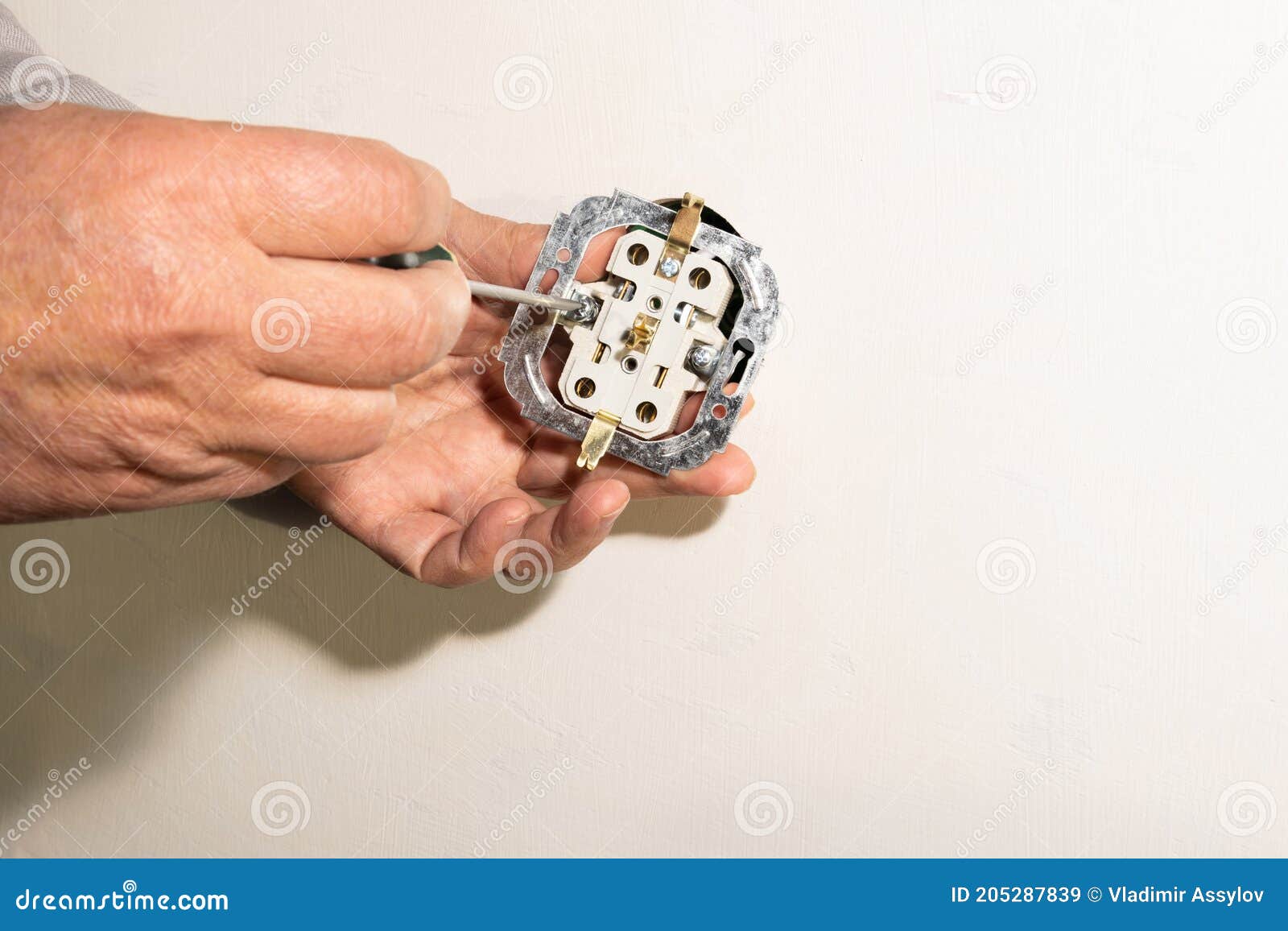 A Man Installs an Electrical Socket in the Wall. Stock Image - Image of ...