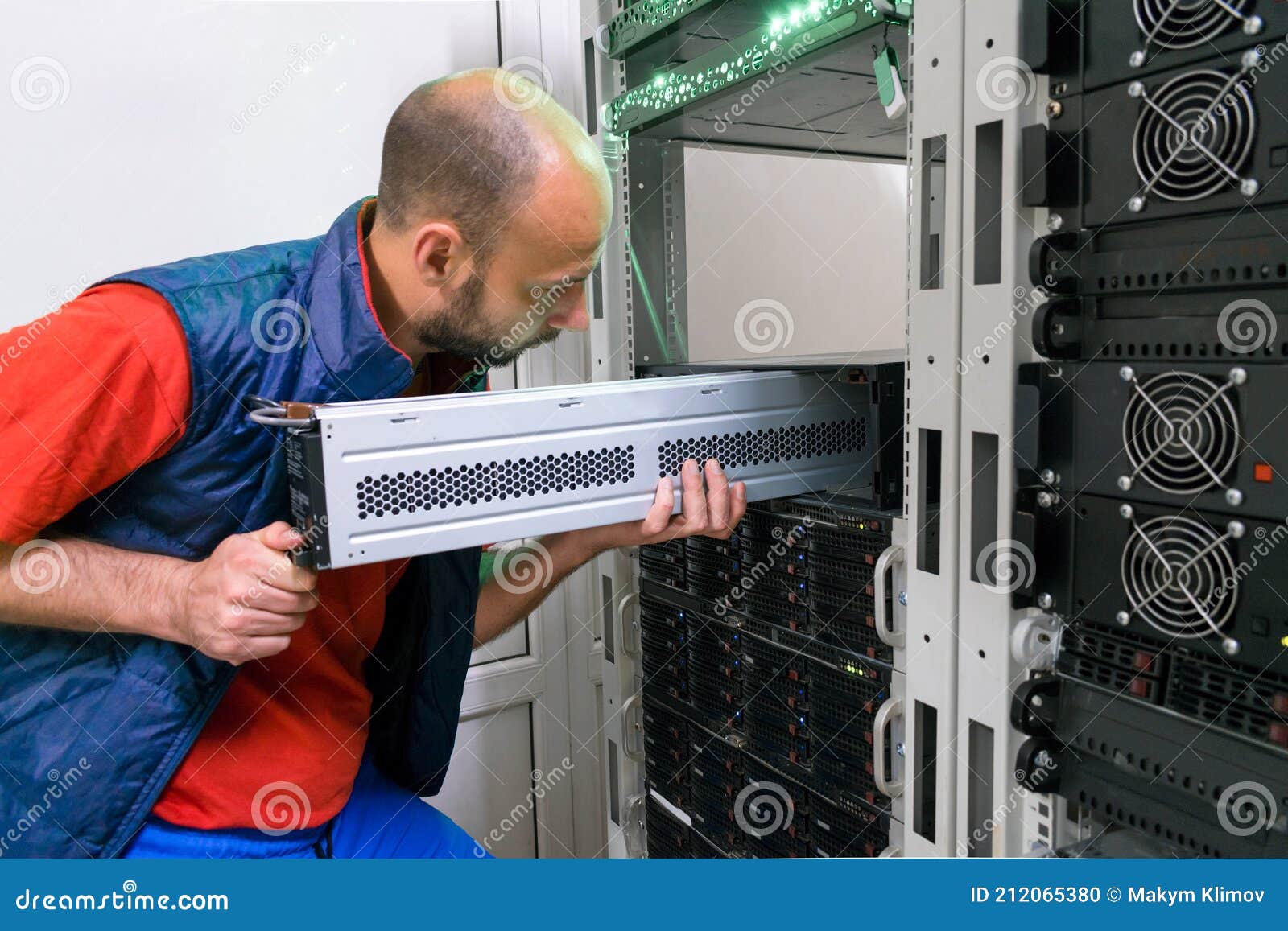The Man Installs a New Battery into the Uninterruptible Power Supply ...