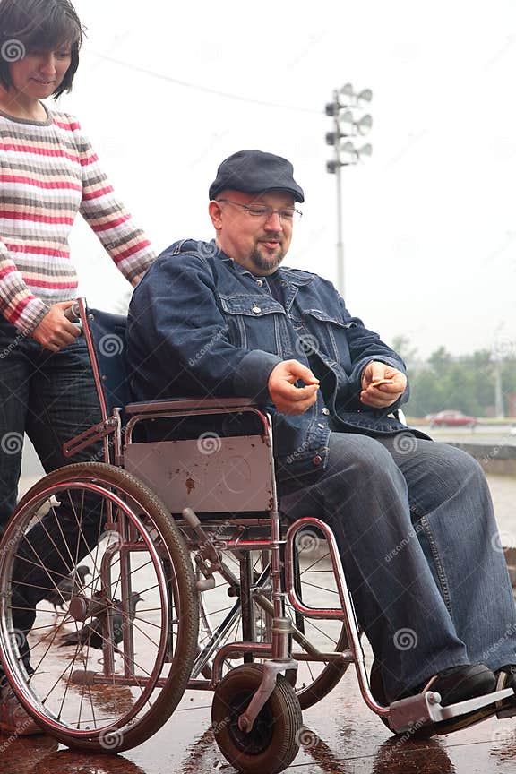Man in an invalid carriage stock photo. Image of invalidness - 9953136