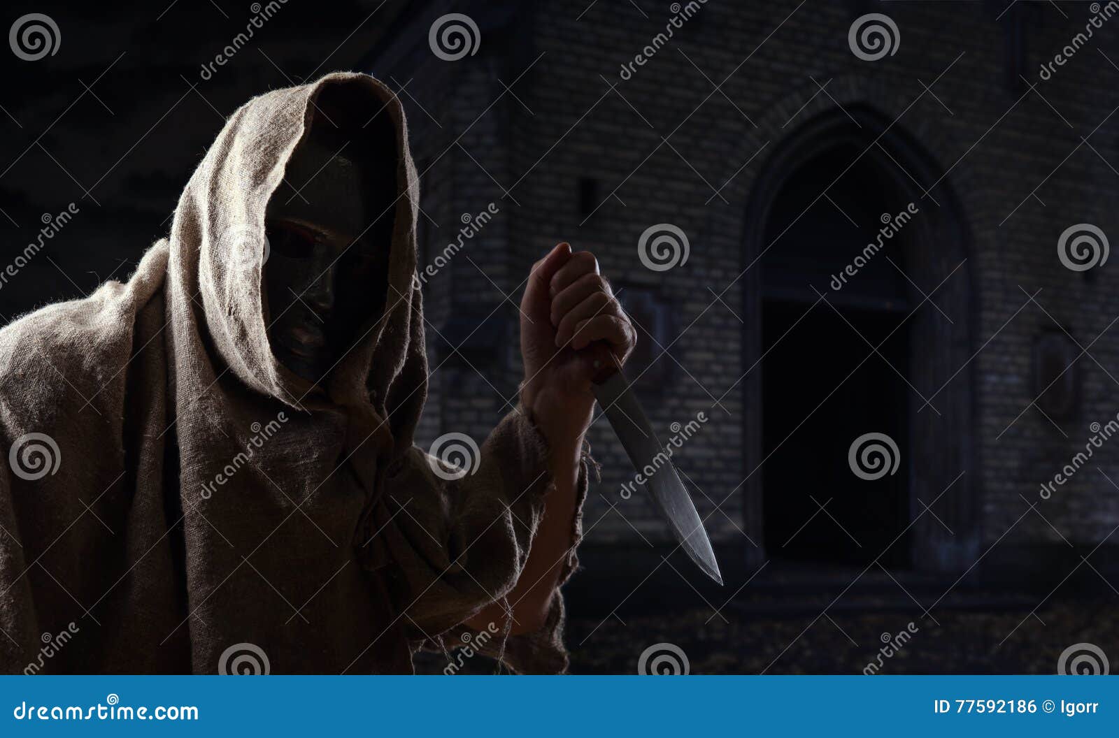 Man in Iron Mask with Knife Stock Photo - Image of horror, danger: 77592186