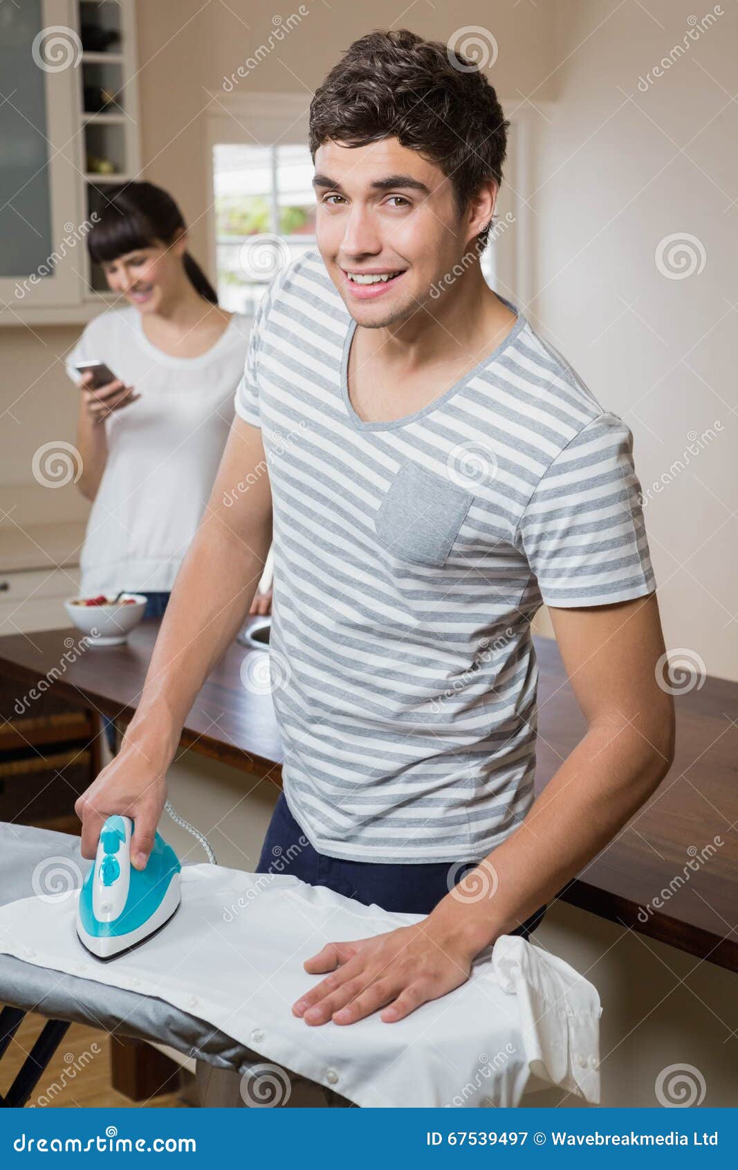 Man ironing a shirt stock image. Image of casual, laundry - 67539497