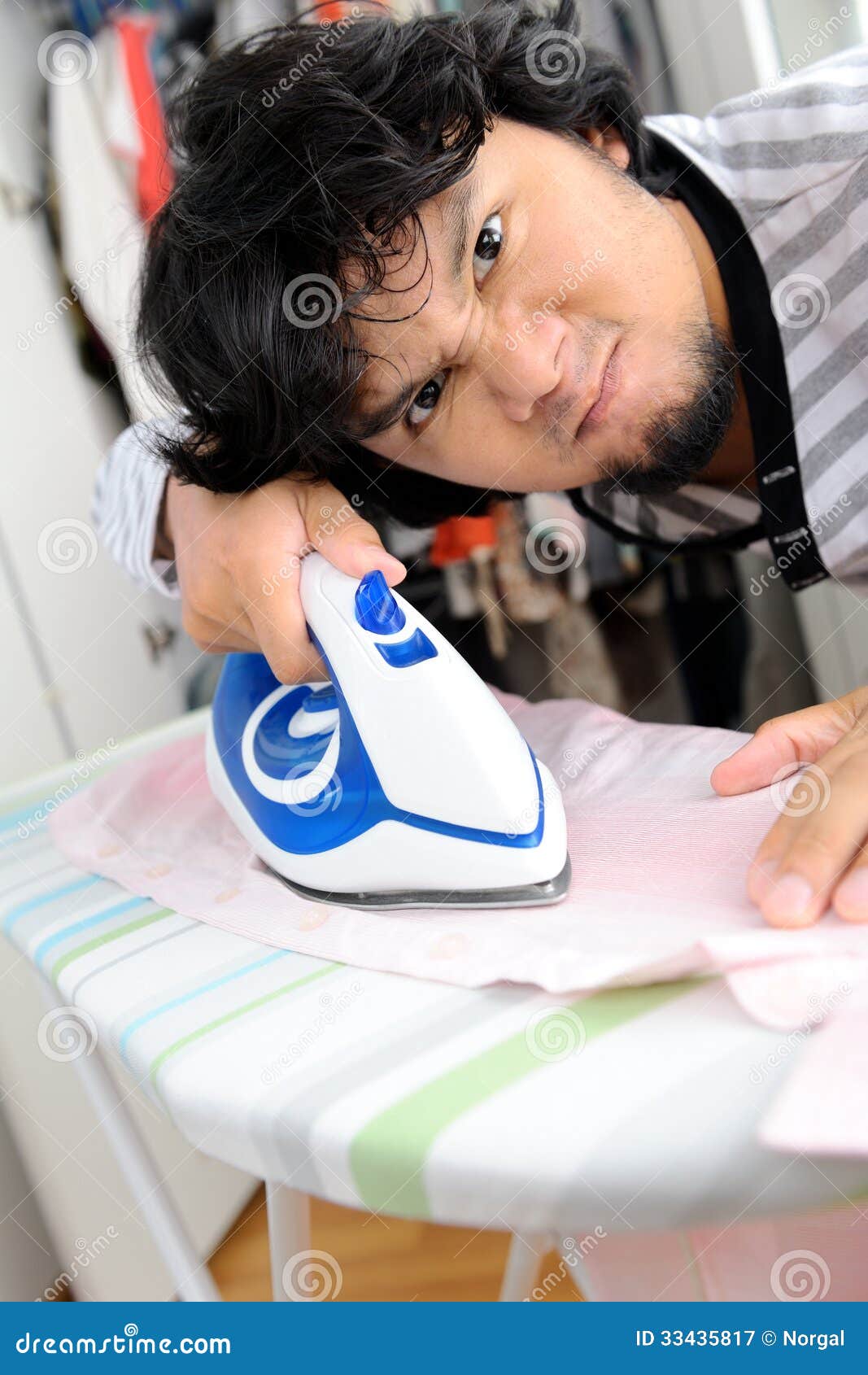 Man ironing stock image. Image of frowning, studio, asian - 33435817