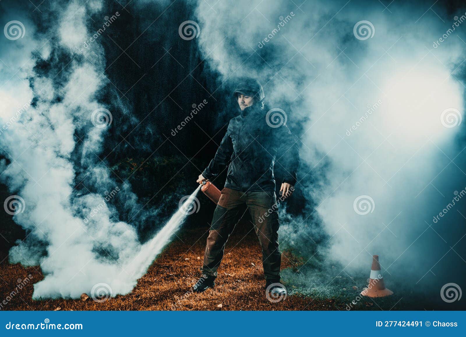 Man in a Jacket Testing a Fire Extinguisher Stock Image - Image of ...