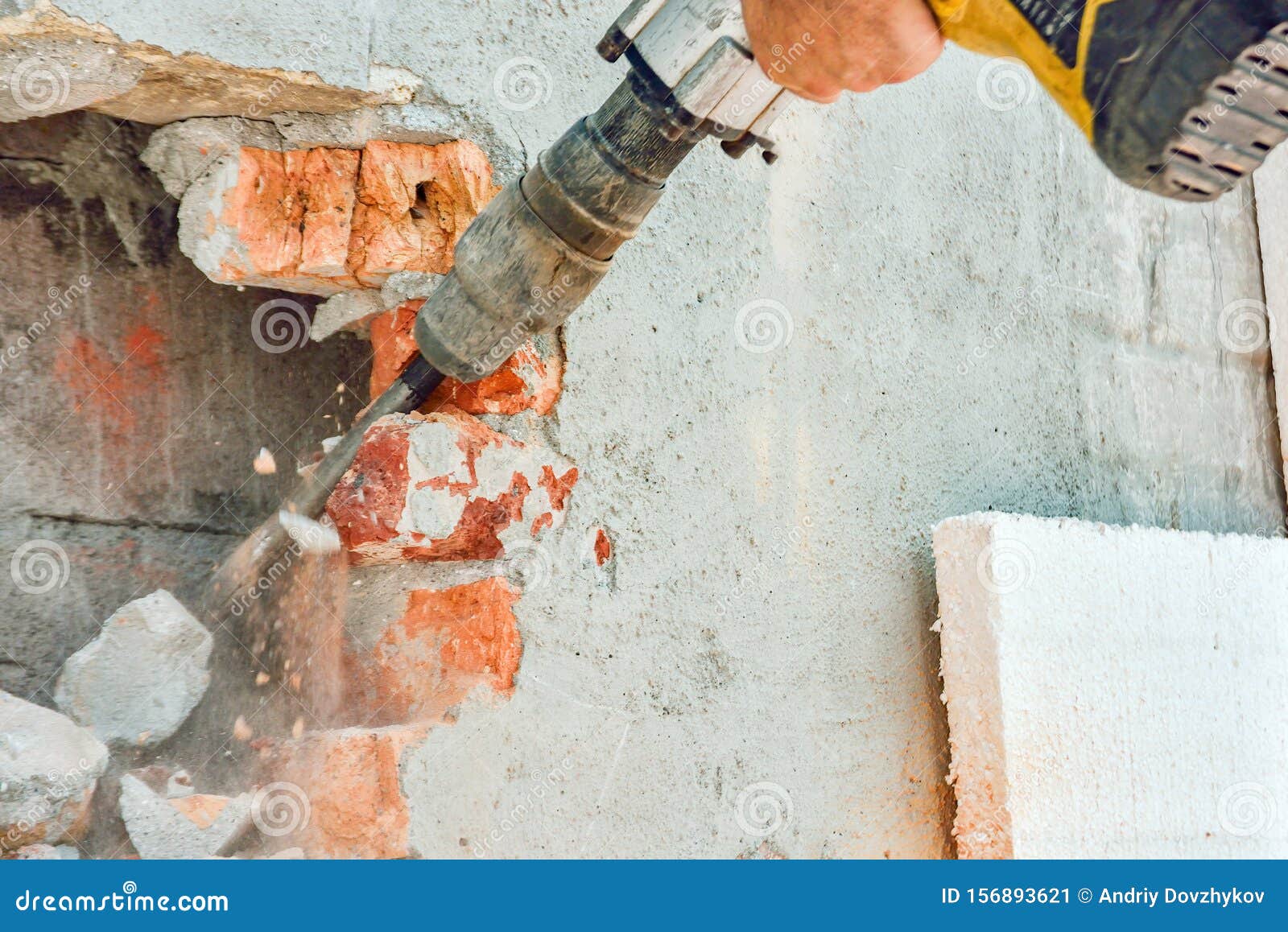 A Man with a Jackhammer Makes an Opening in the Wall Stock Image ...