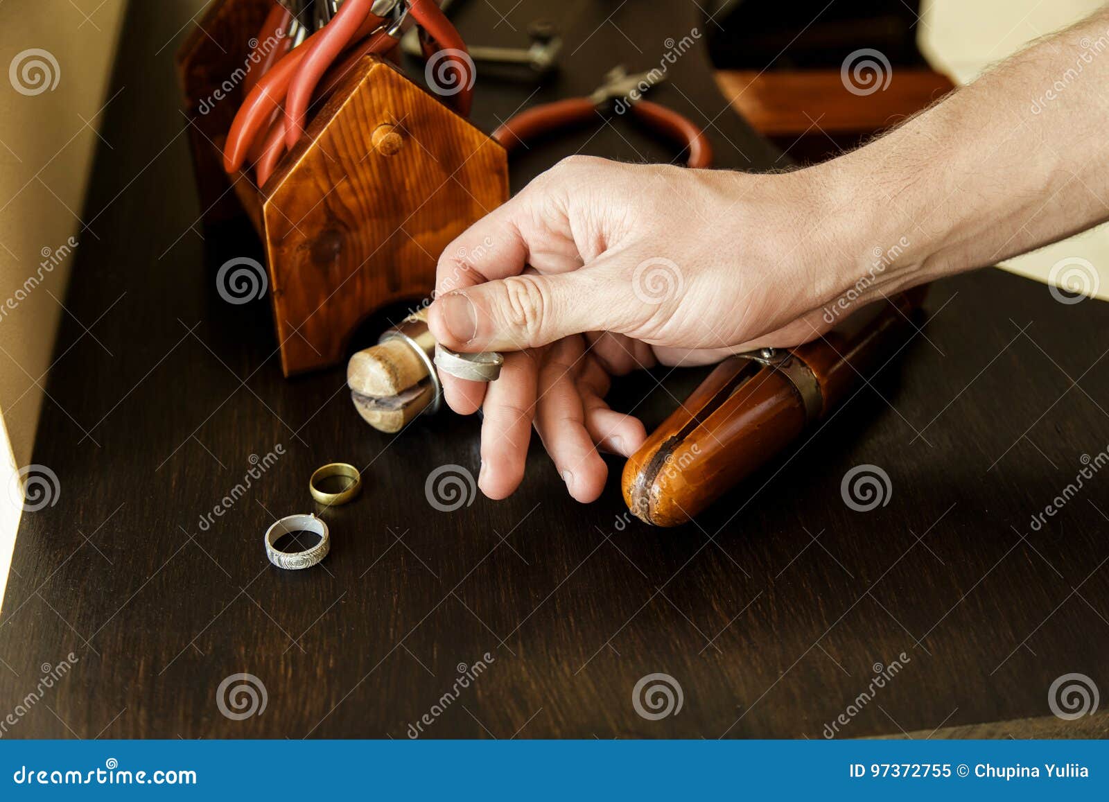 The Man the Jeweler Chooses the Form for Manufacturing of a Ring Stock ...