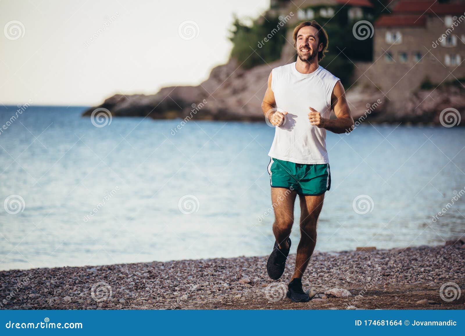 Man Jogging on Beach. Male Runner Training Outside Working Out Stock ...