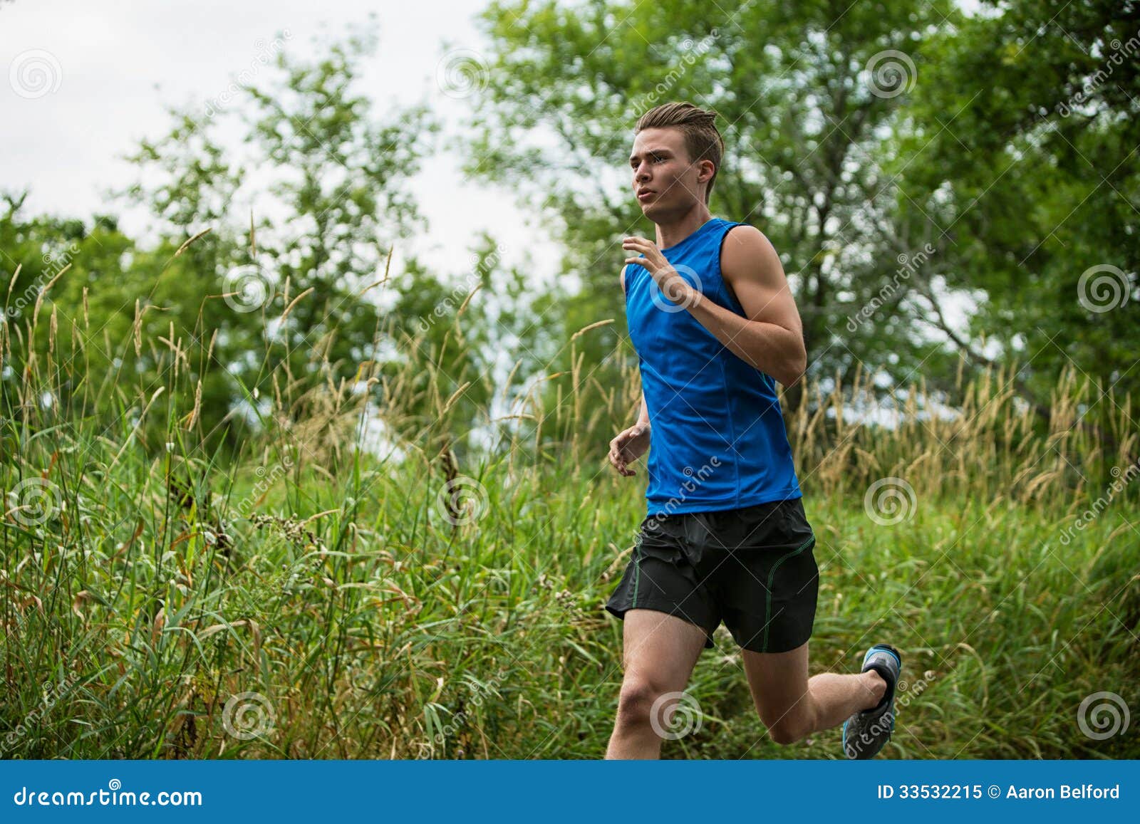 Man Jogging in Field stock image. Image of individuality - 33532215