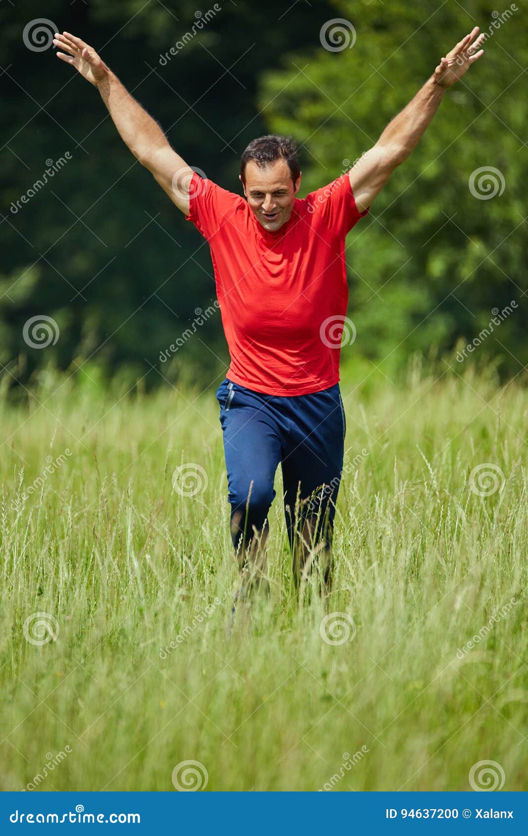 Happy man jumping for joy stock photo. Image of athletic - 94637200