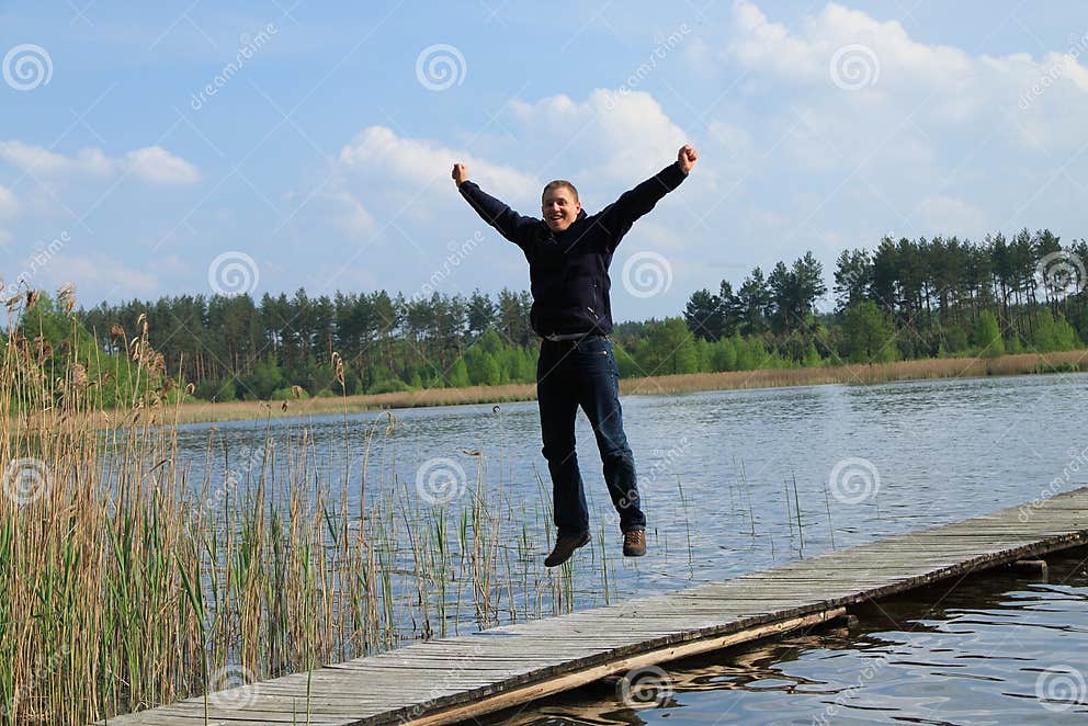 Man juming on pier stock image. Image of smile, smiling - 5542259