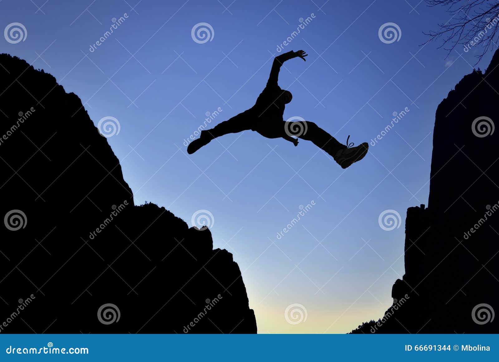 Man Jump through the Gap stock photo. Image of adventure - 66691344