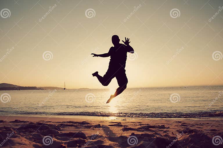 Man Jump in the Sunset on the Beach Stock Image - Image of happiness ...